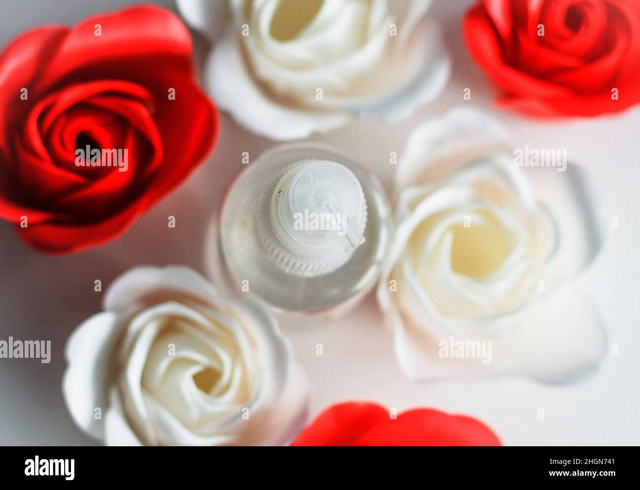 Cosmetic product in a bottle on a bong background with roses Stock ...