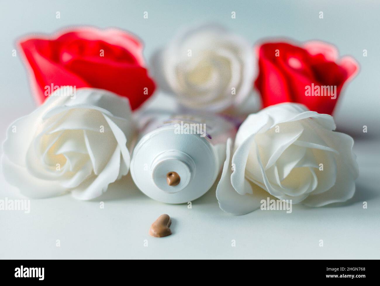 cosmetic product in a tube on a bong background with roses Stock Photo ...
