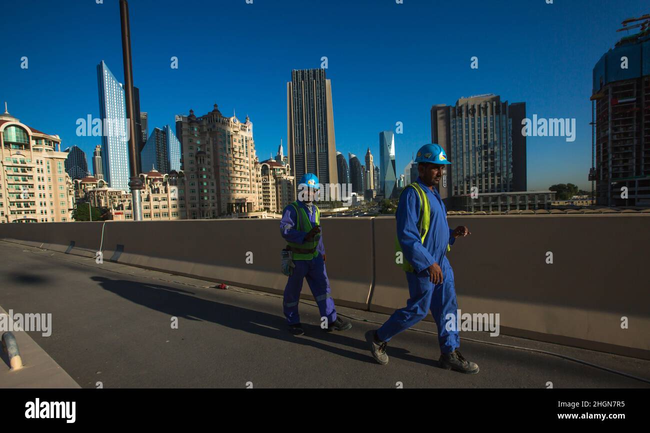 UNITED ARAB EMIRATES. DUBAI. WORKERS ON TRADE CENTER DISTRICT Stock ...