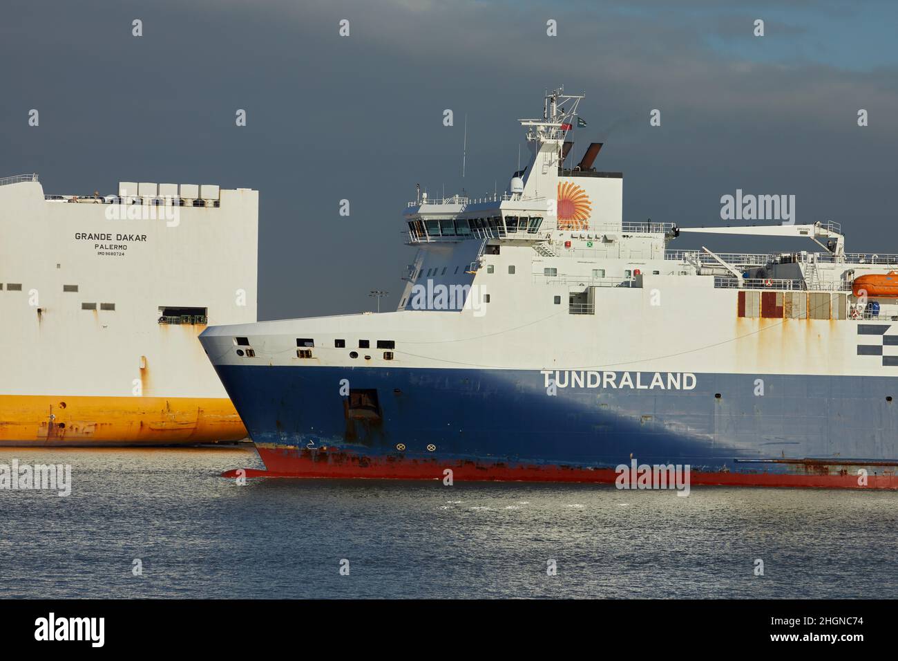 The Tundraland Ro-Ro cargo ship passing the Grande Dakar which is ...