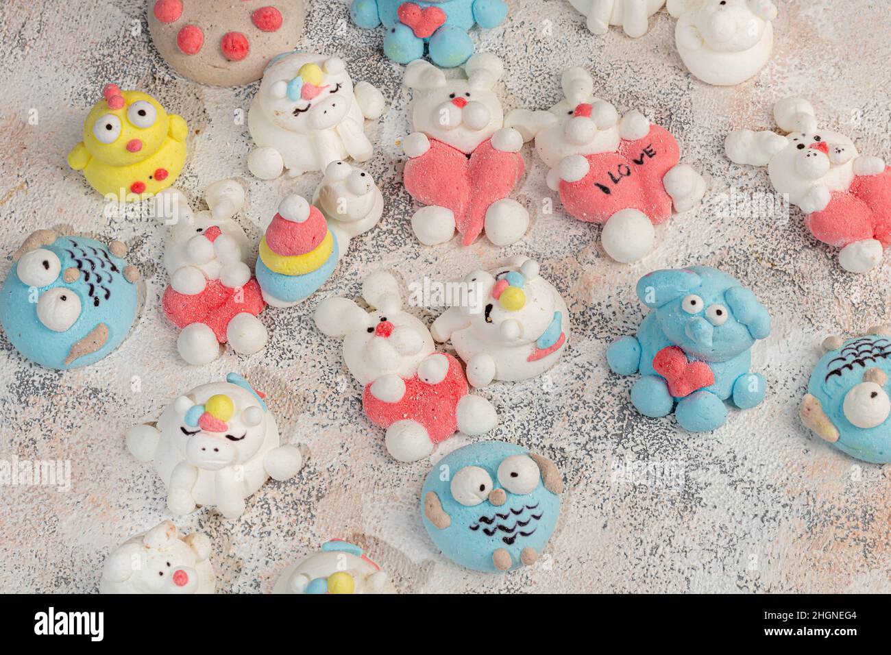 Marshmallow in the form of handmade animals on a light background. In a ...