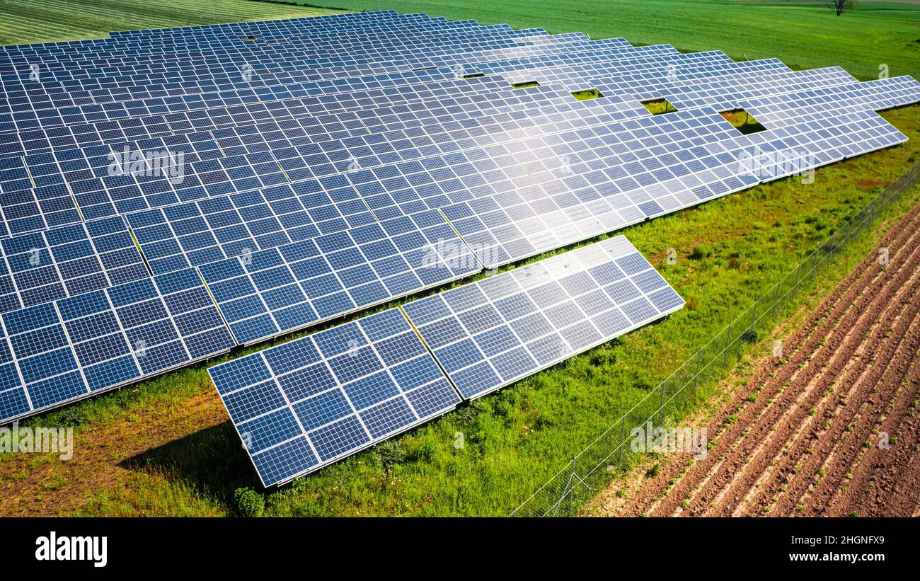 Big and blue solar panels as a renewable energy source. Pure energy in ...
