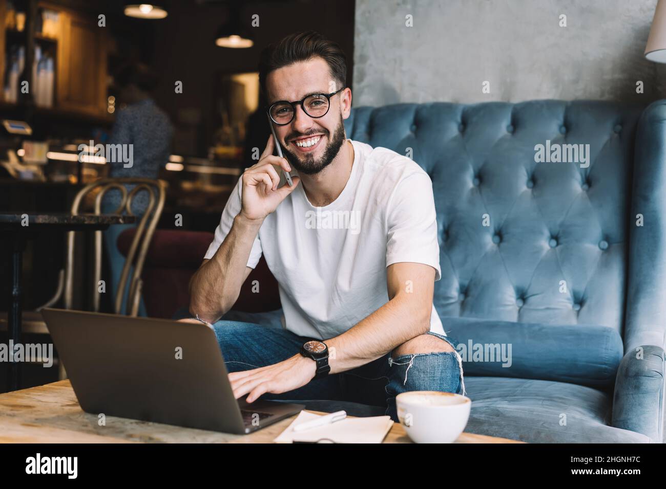 happy Caucaisan blogger using 4g for calling and talk Stock Photo - Alamy