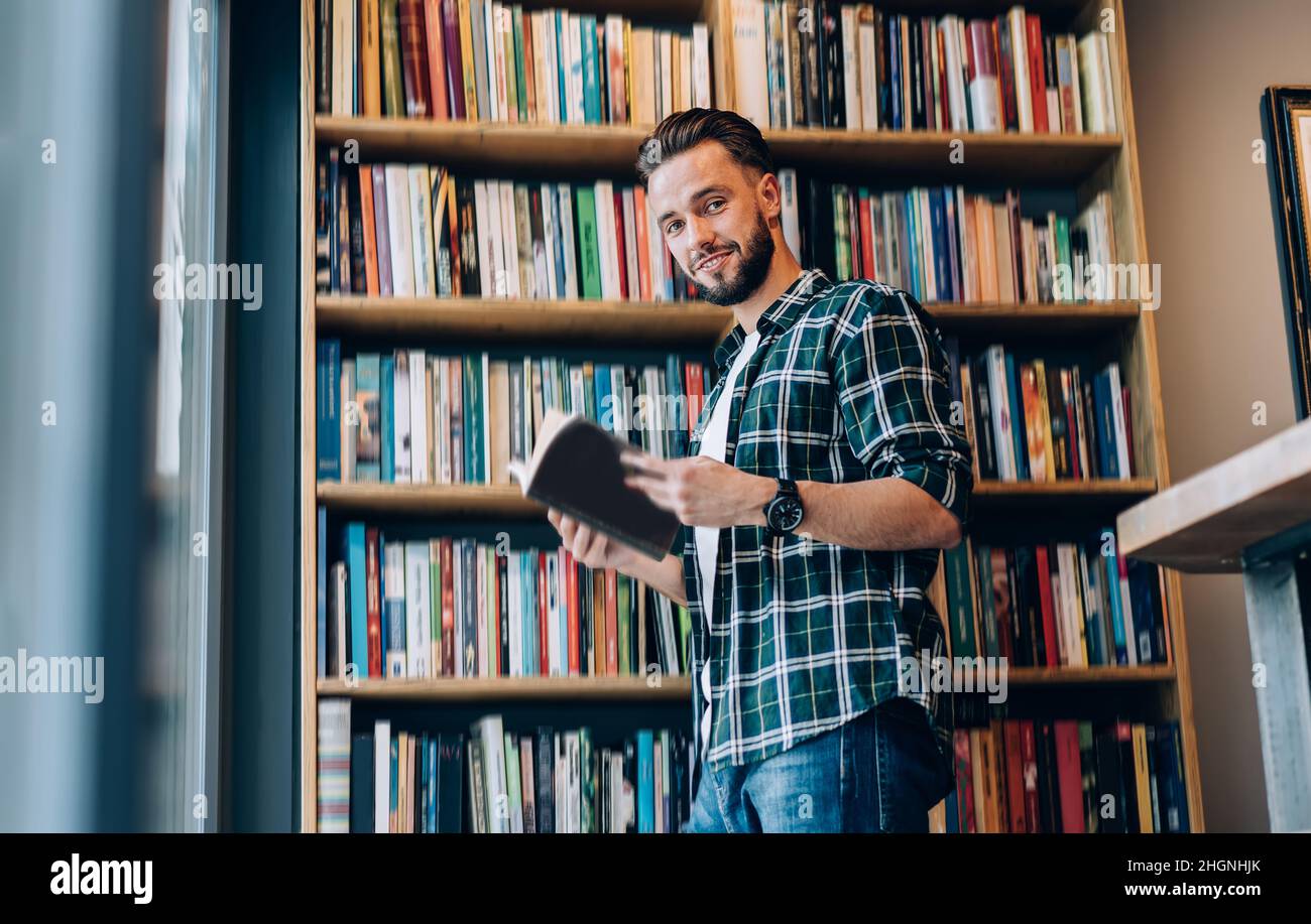 knowledge and wisdom education concept. man in library Stock Photo - Alamy