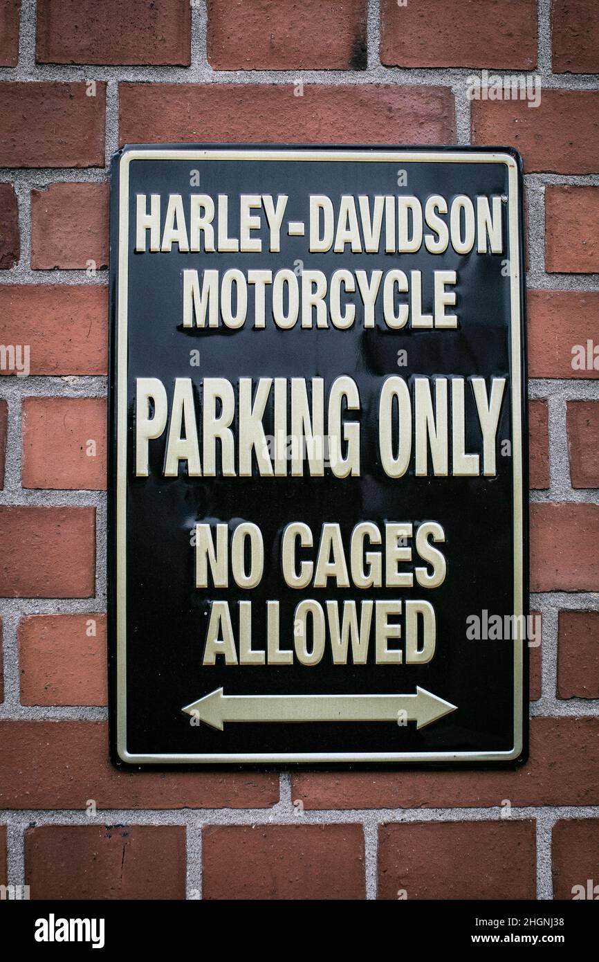 harley davidson parking only sign on brick wall Stock Photo - Alamy