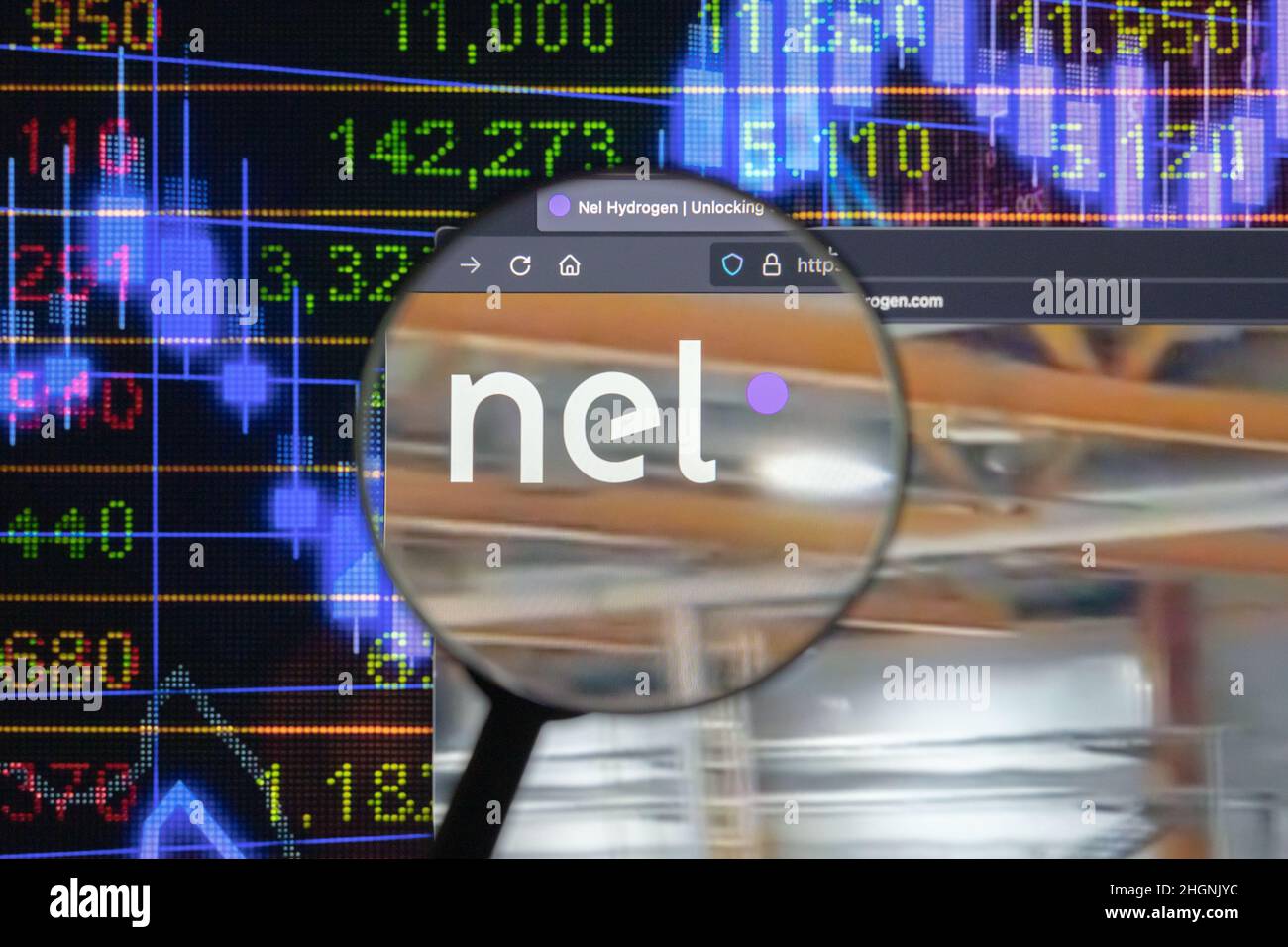 Nel company logo on a website with blurry stock market developments in ...
