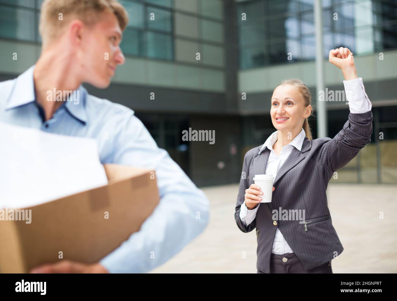 Businesswoman is wishing good luck to worker Stock Photo - Alamy