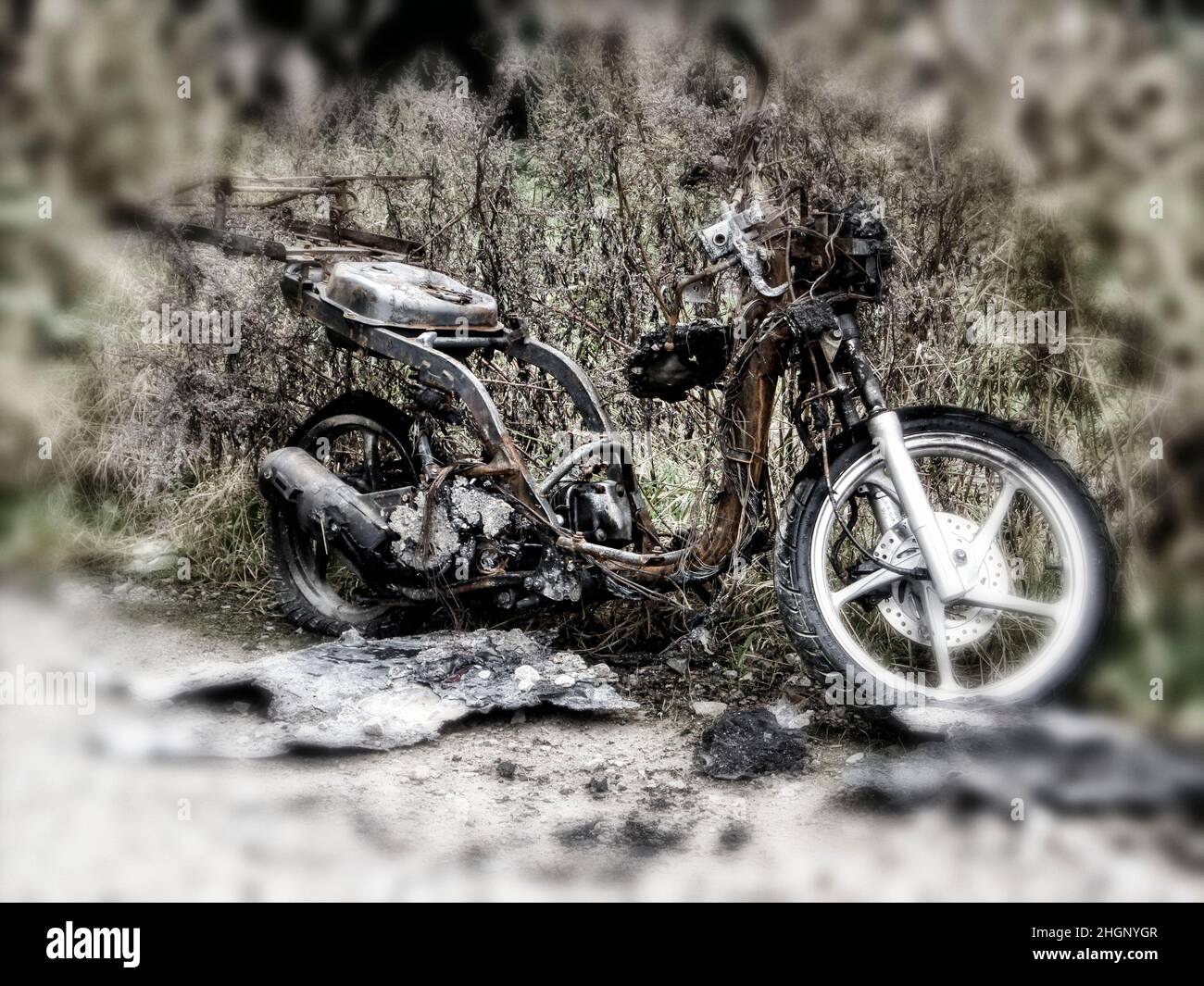Stolen, burned out and abandoned motorcycle in the countryside Stock ...