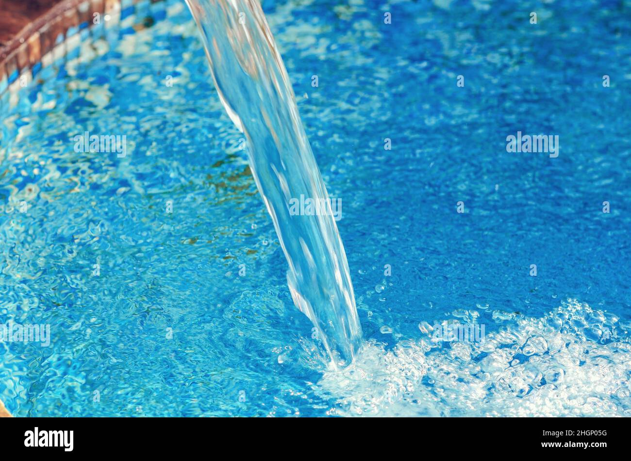 Falling stream of fresh clean spring water. Energy of nature Stock ...
