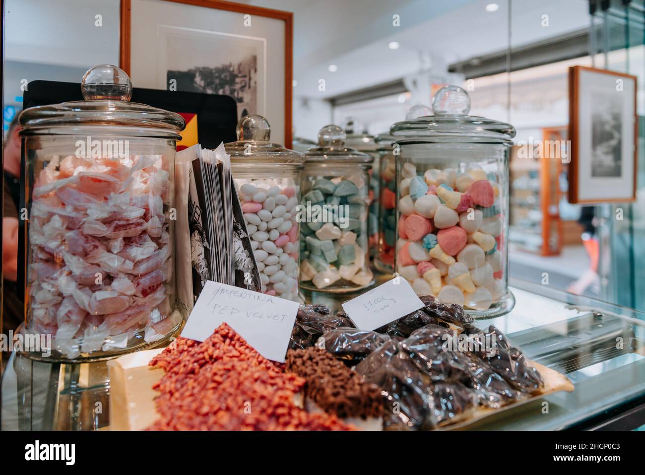 Pastry shop display window of delicatessen store with variety of cakes ...