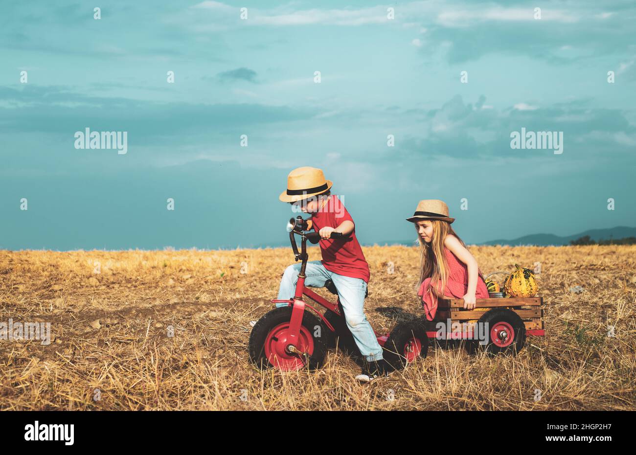 Little farmers kids in village. Beautiful children is riding the ...