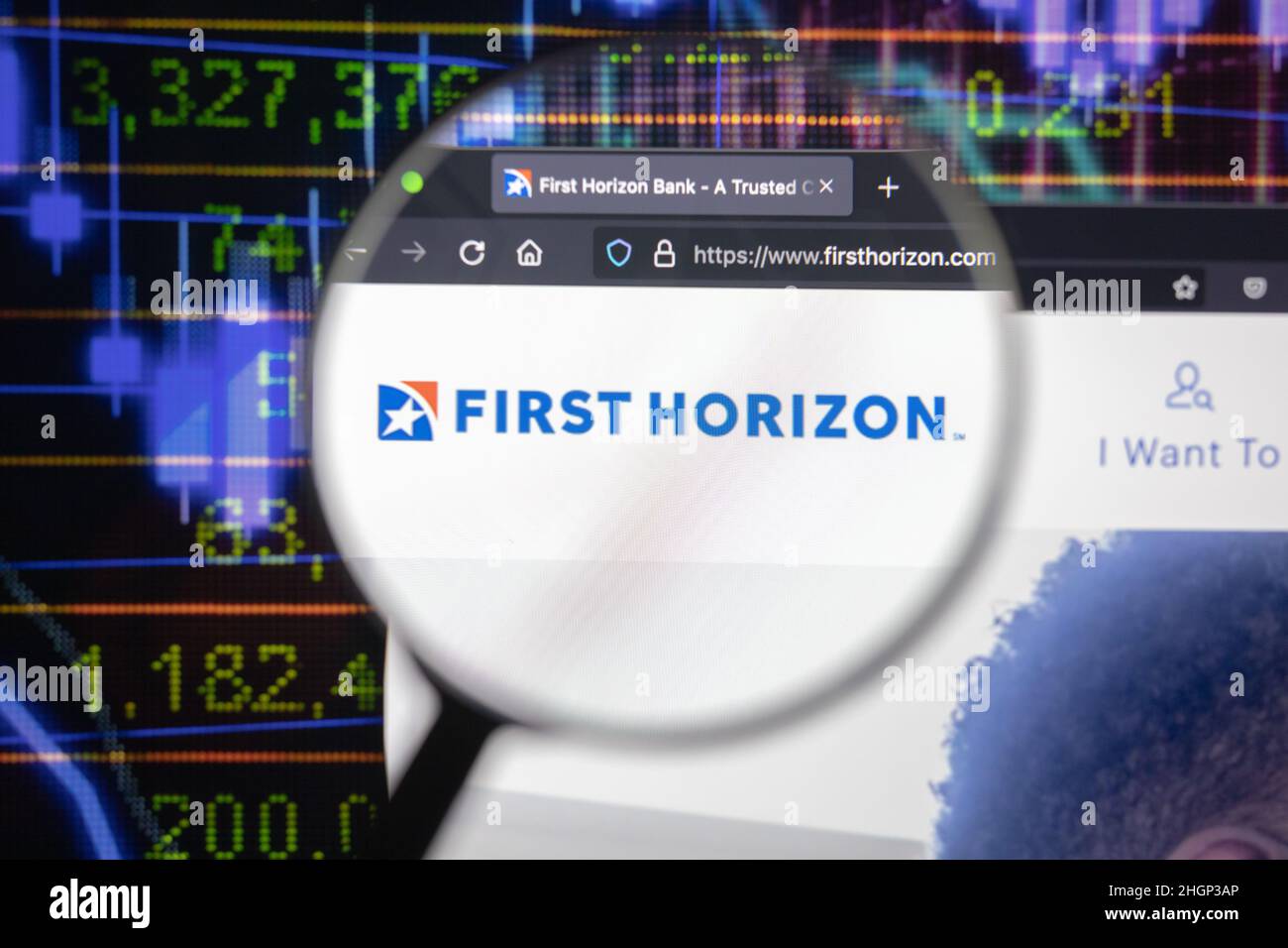 First Horizon company logo on a website with blurry stock market developments in the background ...