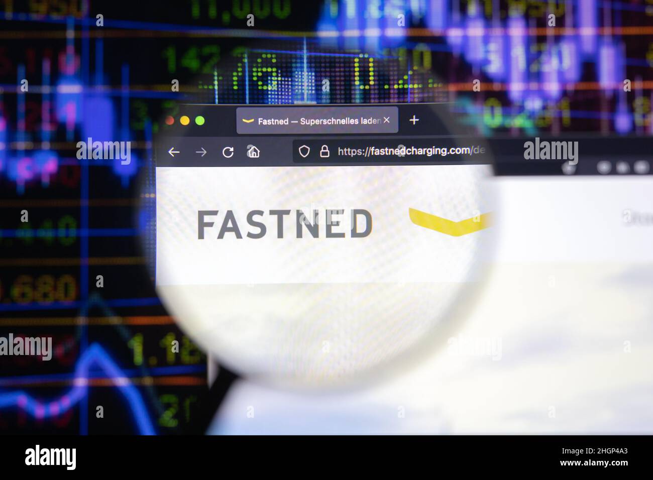 Fastned company logo on a website with blurry stock market developments in the background, seen ...