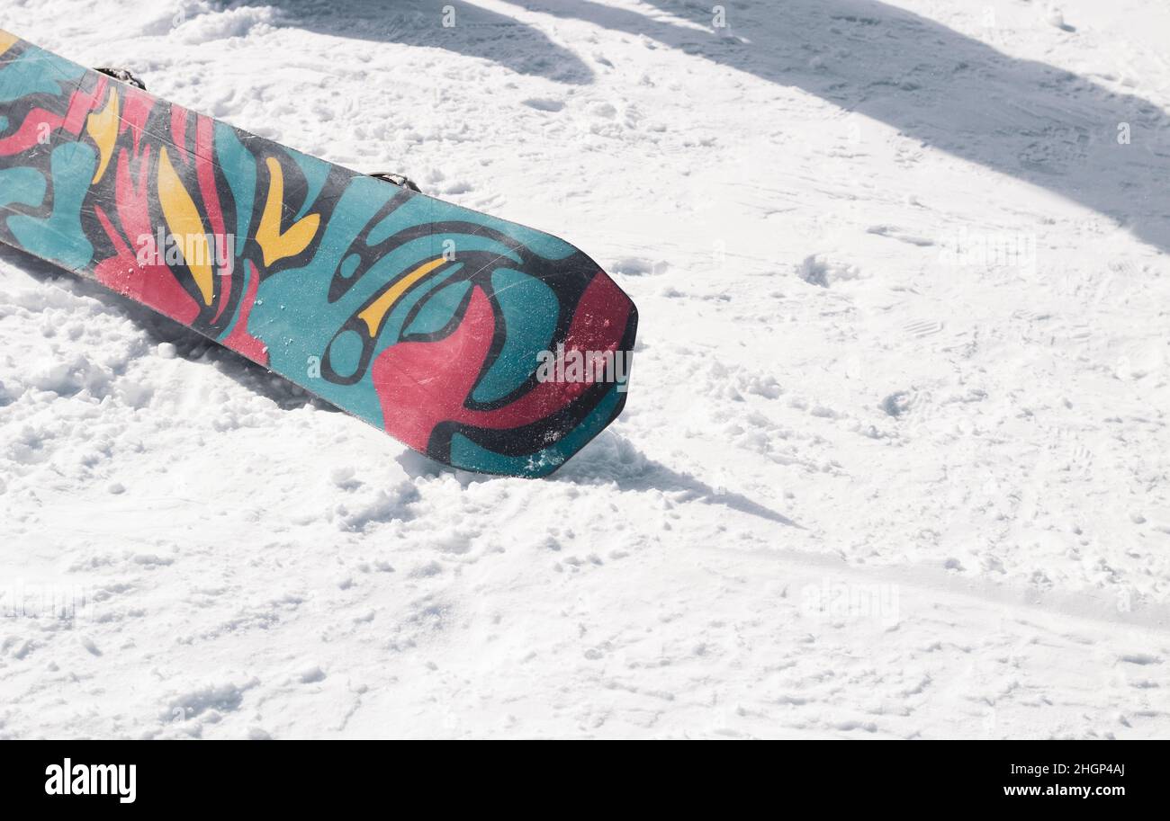 Snowboard on the snowy ground in the mountain. Snowboard standing ...