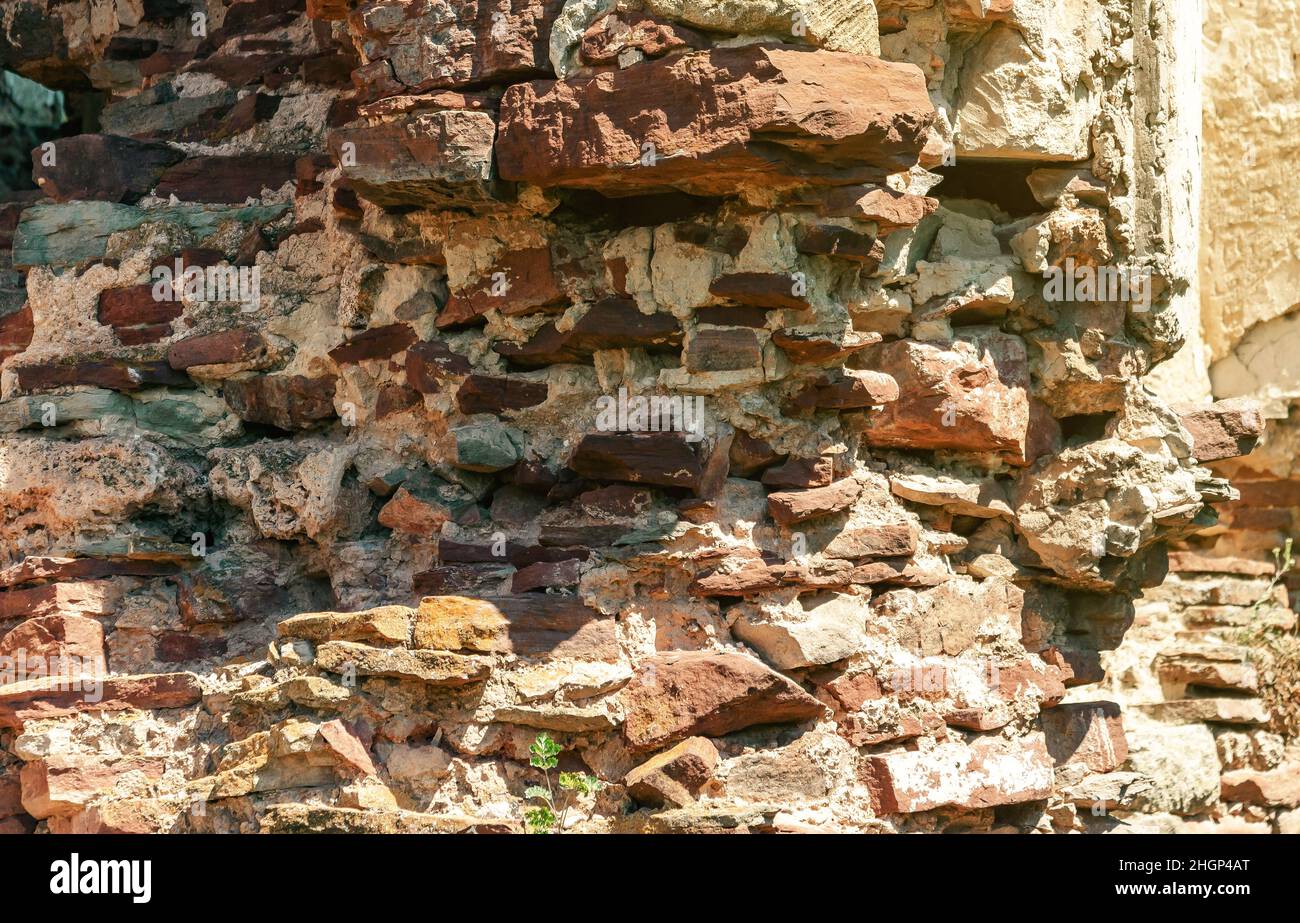Part of ruined stone wall of fortress. Stone texture, abstract ...