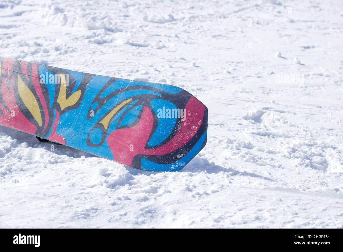 Snowboard on the snowy ground in the mountain. Snowboard standing ...