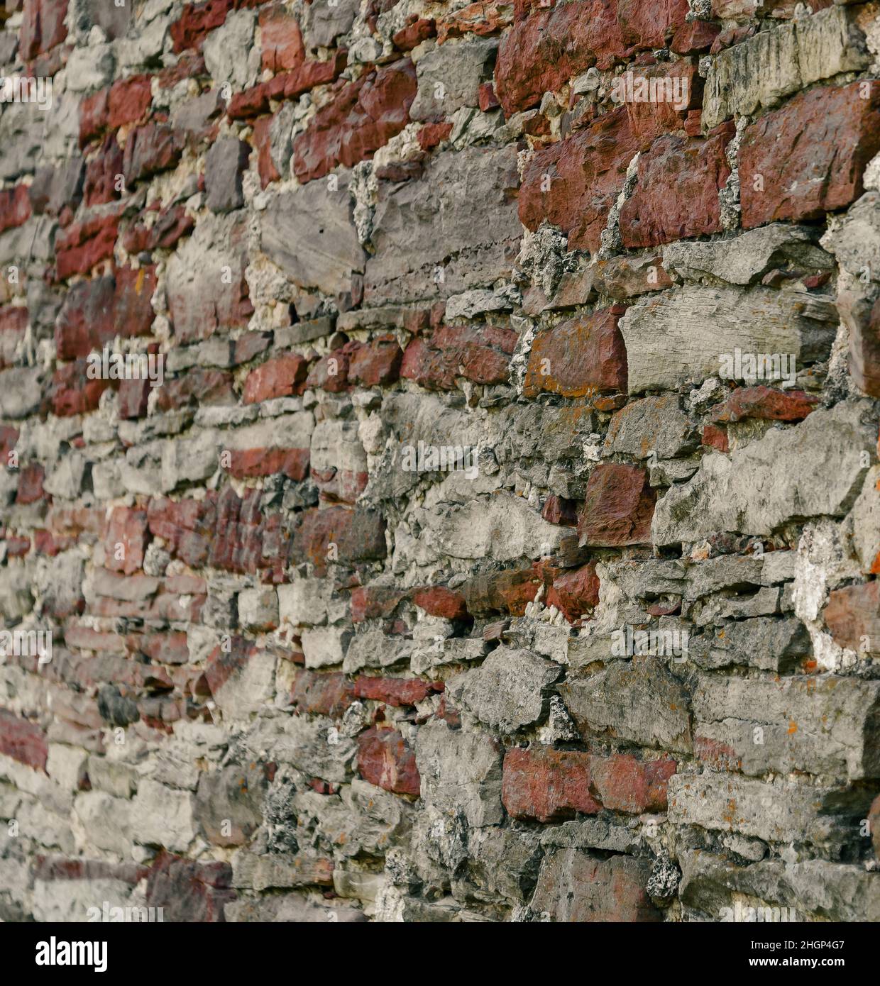 Part of ruined stone wall of fortress. Stone texture, abstract ...