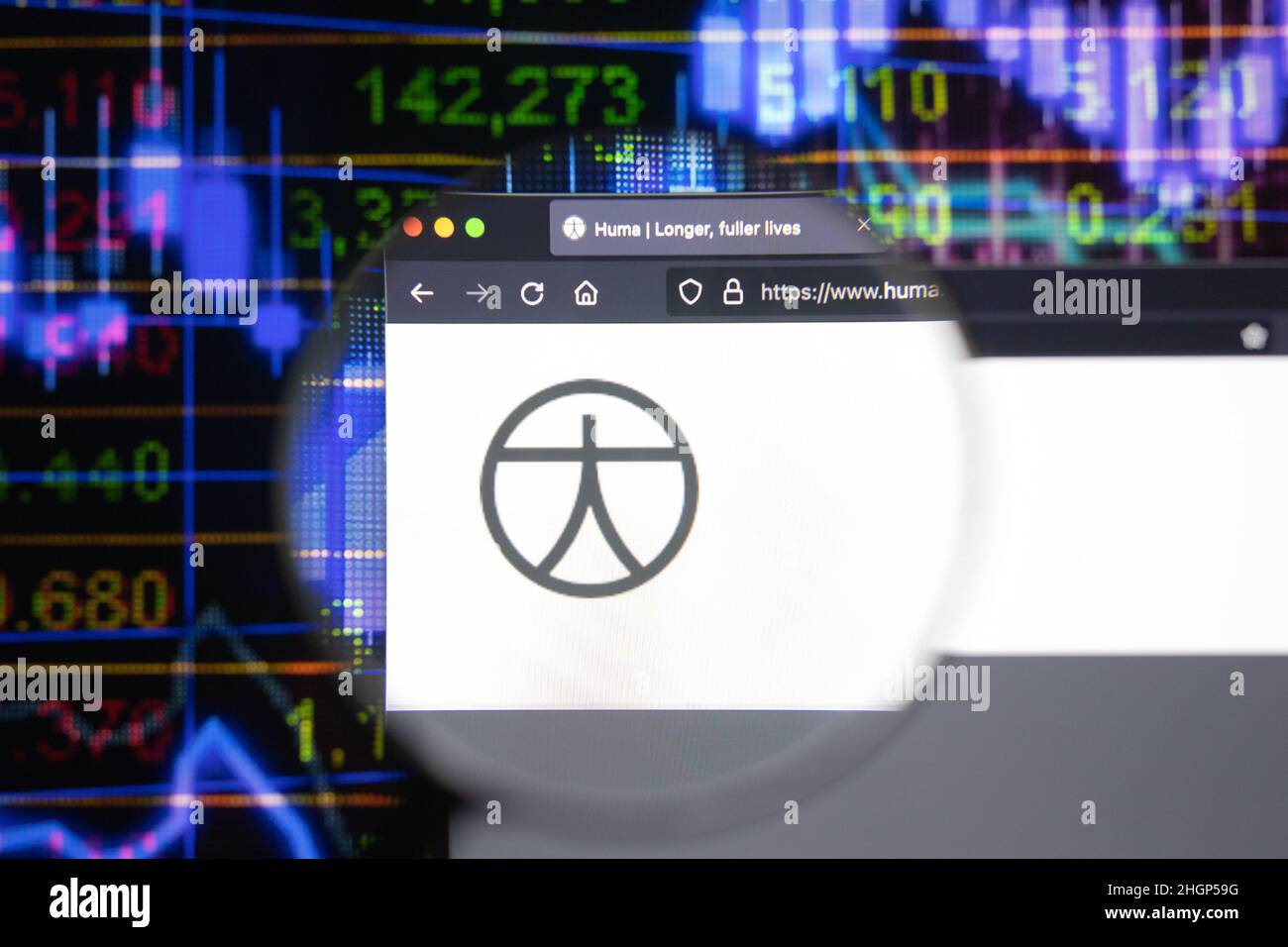 Huma company logo on a website with blurry stock market developments in ...