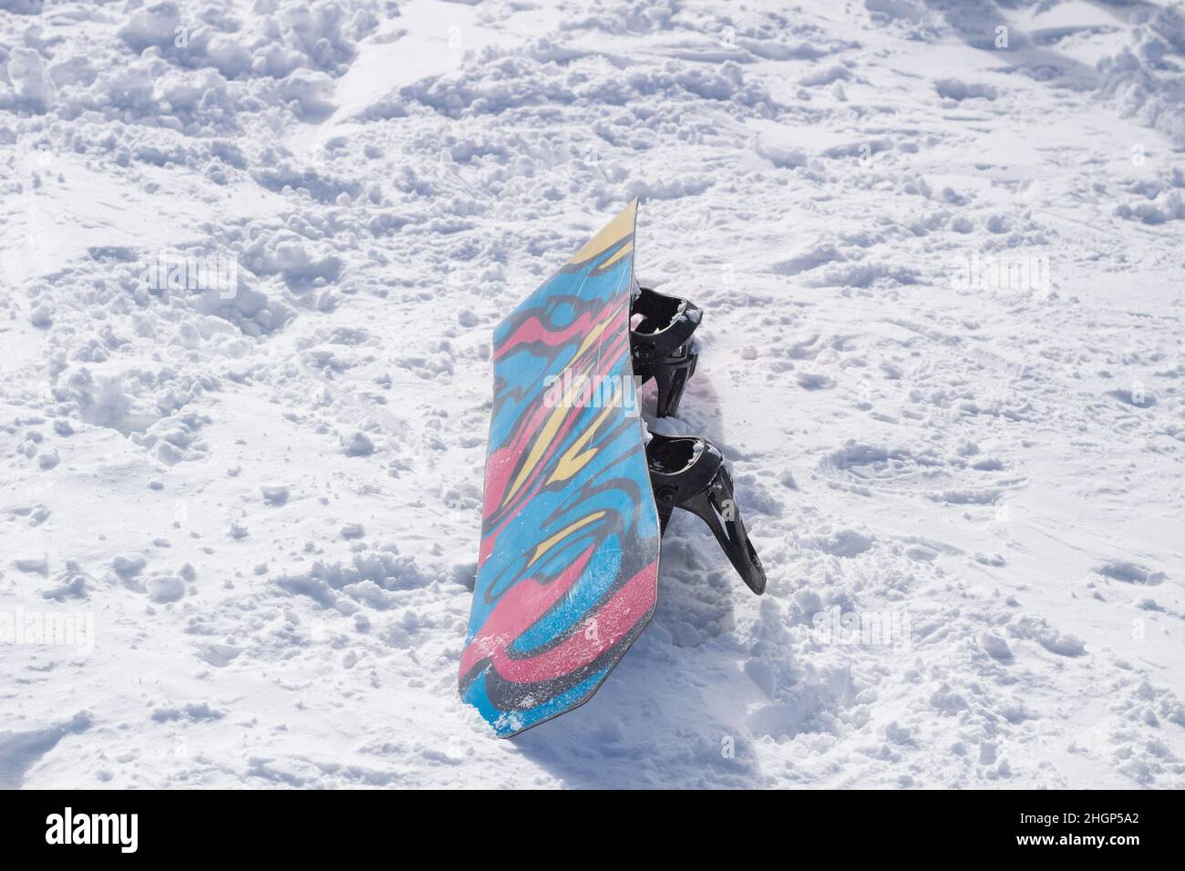 Snowboard on the snowy ground in the mountain. Snowboard standing ...