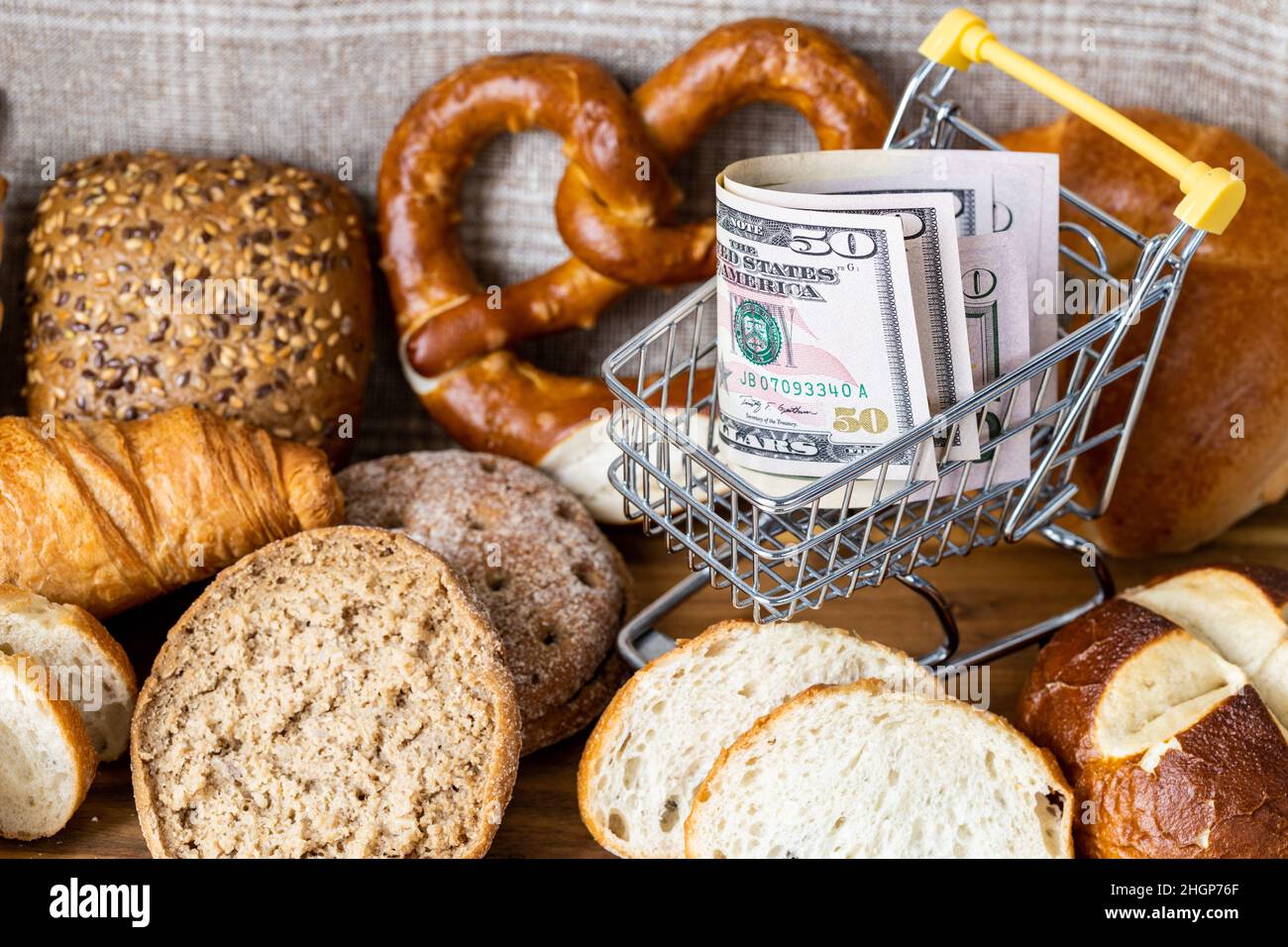 Shopping Cart with US Dollars around Groceries, Breads and Pastries ...
