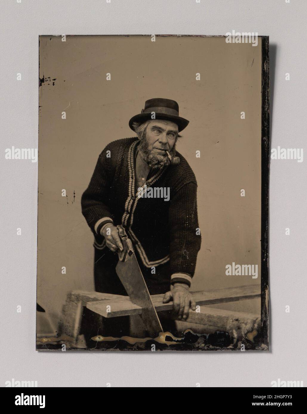 [Carpenter Sawing a Plank of Wood] 1880s–90s Unknown. [Carpenter Sawing ...