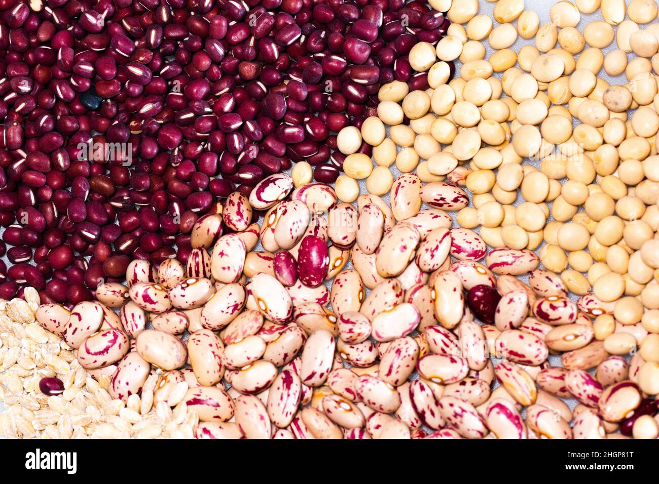 vegan food: pinto beans, pearl barley, soy, azuki beans Stock Photo - Alamy