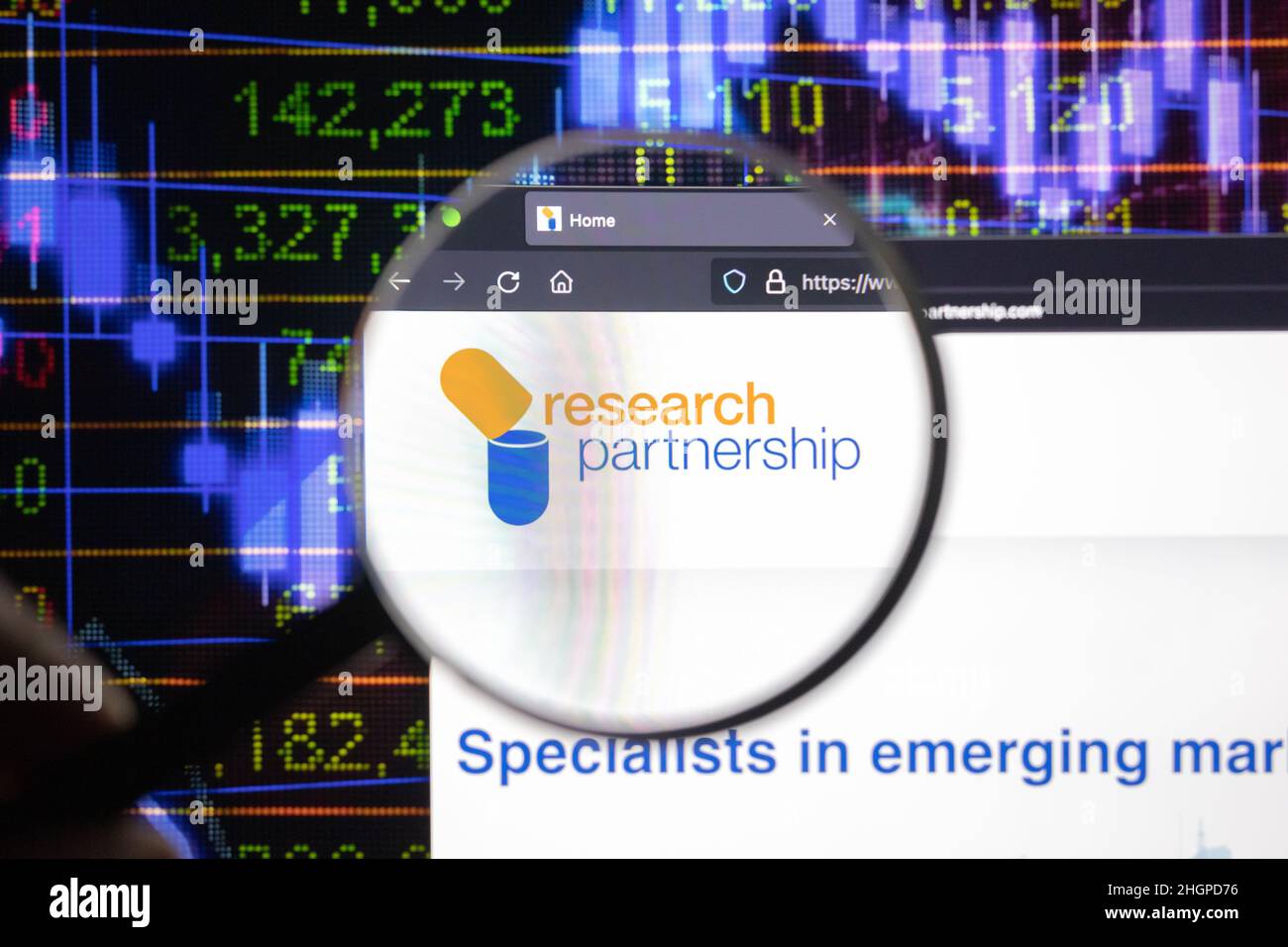 Research Partnership company logo on a website with blurry stock market ...