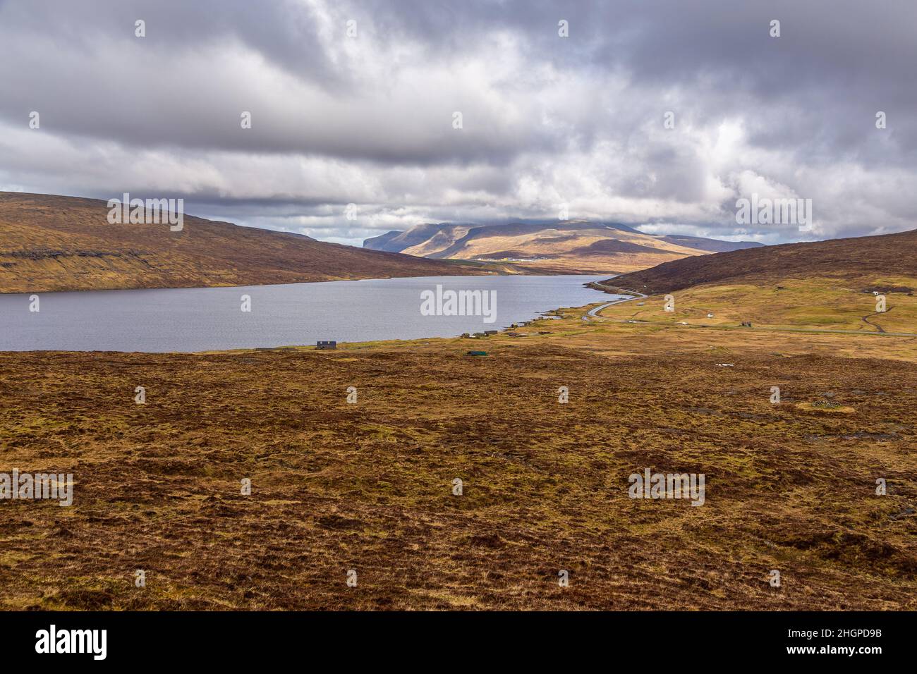 View of the Leitisvatn Lake above the Ocean. Walking area, peat field ...