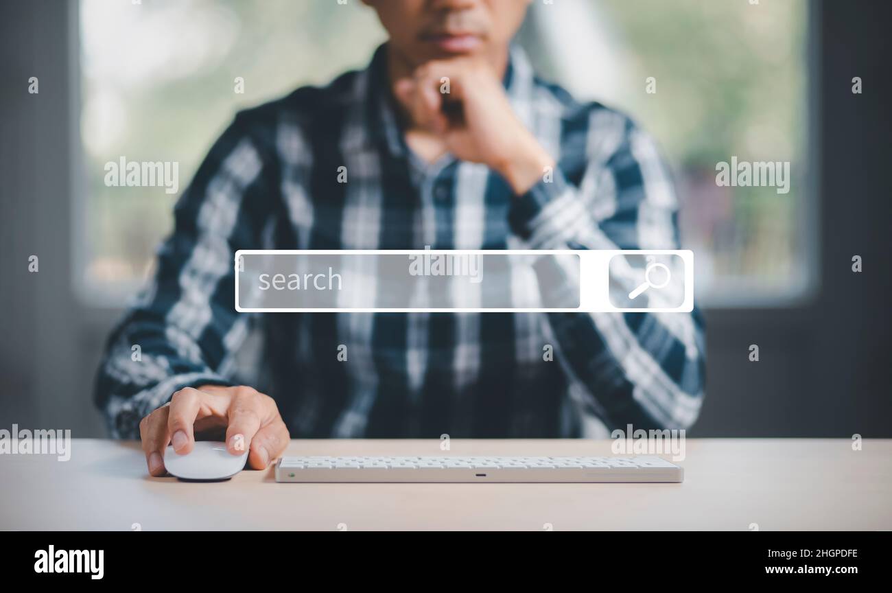 Searching Browsing Internet Data Information with blank search bar. man's hands are using a ...