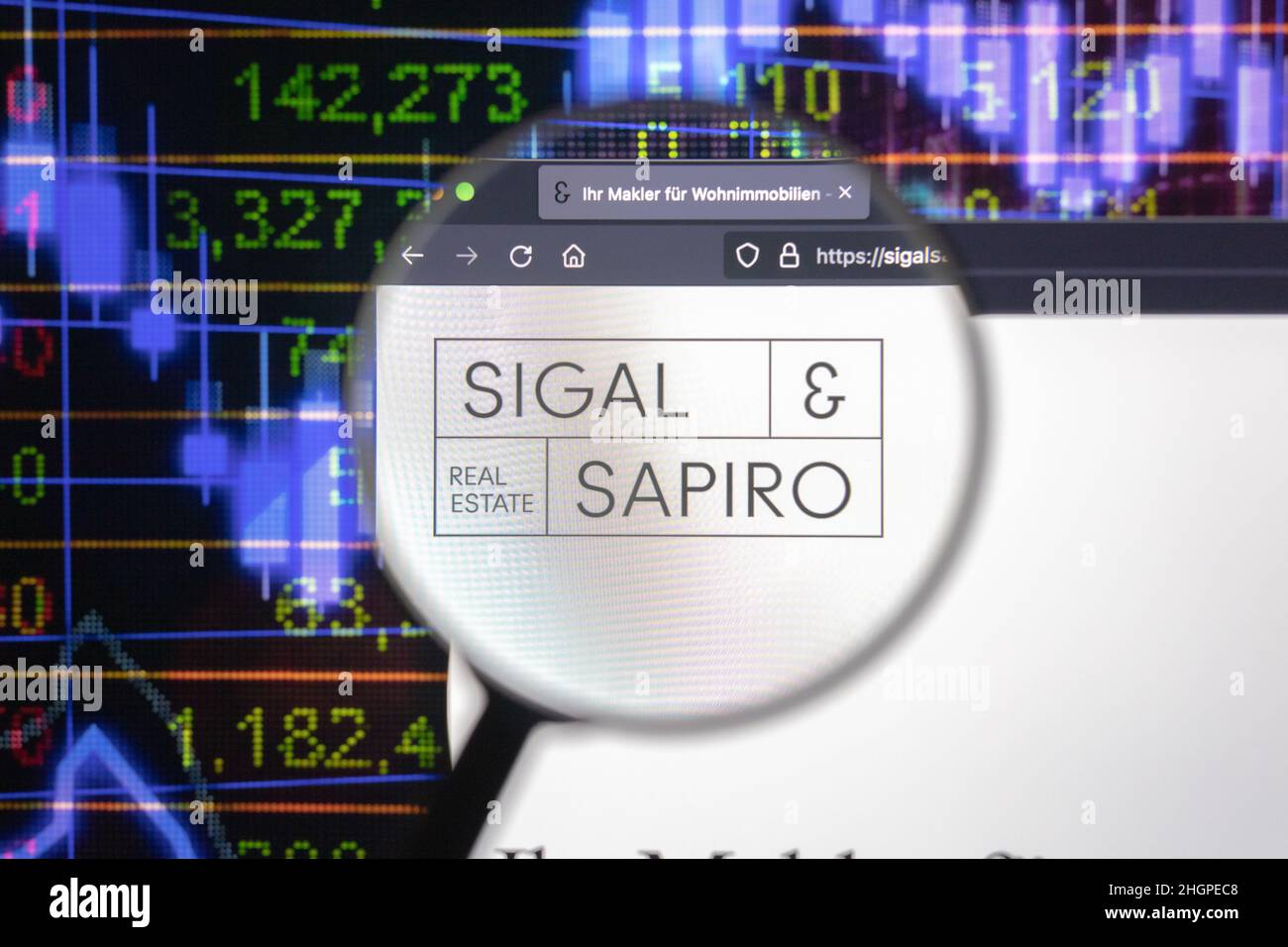 Sigal & Sapiro company logo on a website with blurry stock market ...
