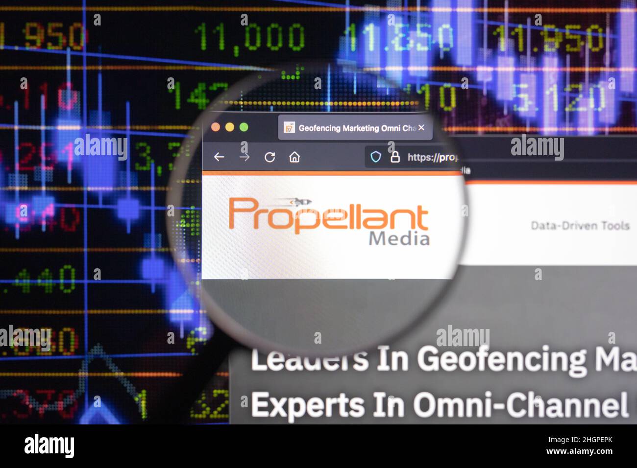Propellant Media company logo on a website with blurry stock market ...