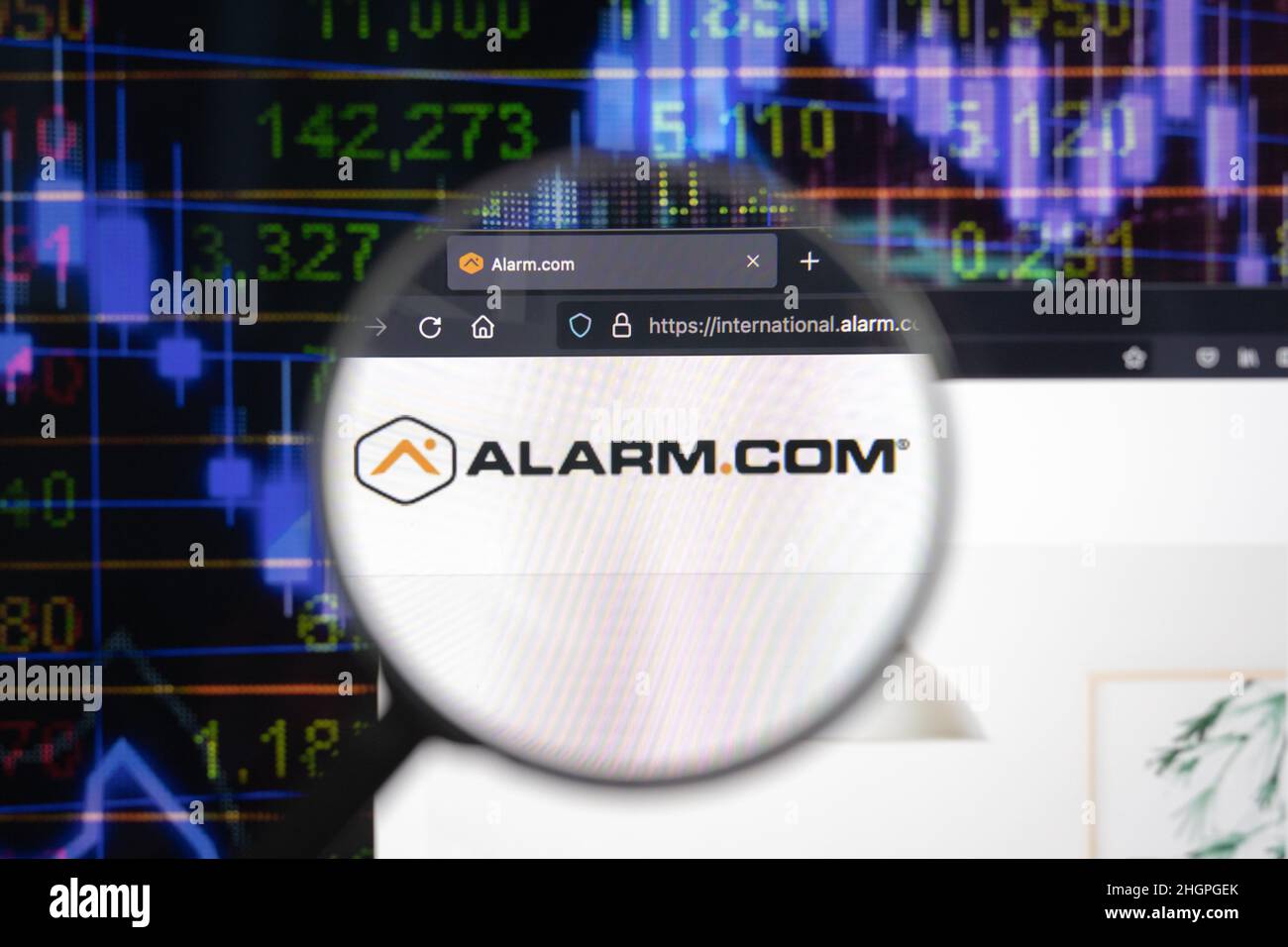 Alarm.com company logo on a website with blurry stock market ...