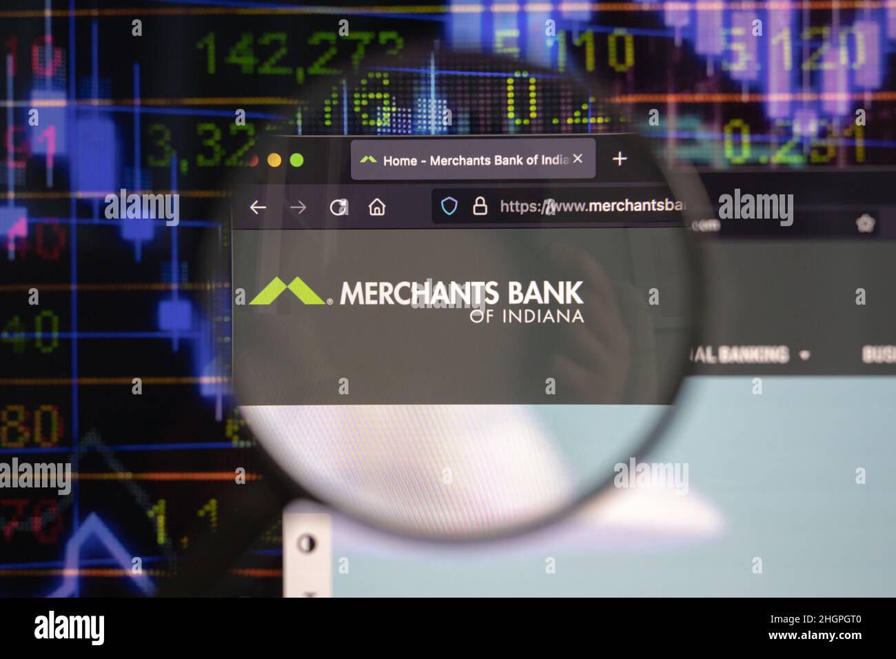 Merchants bank company logo on a website with blurry stock market ...