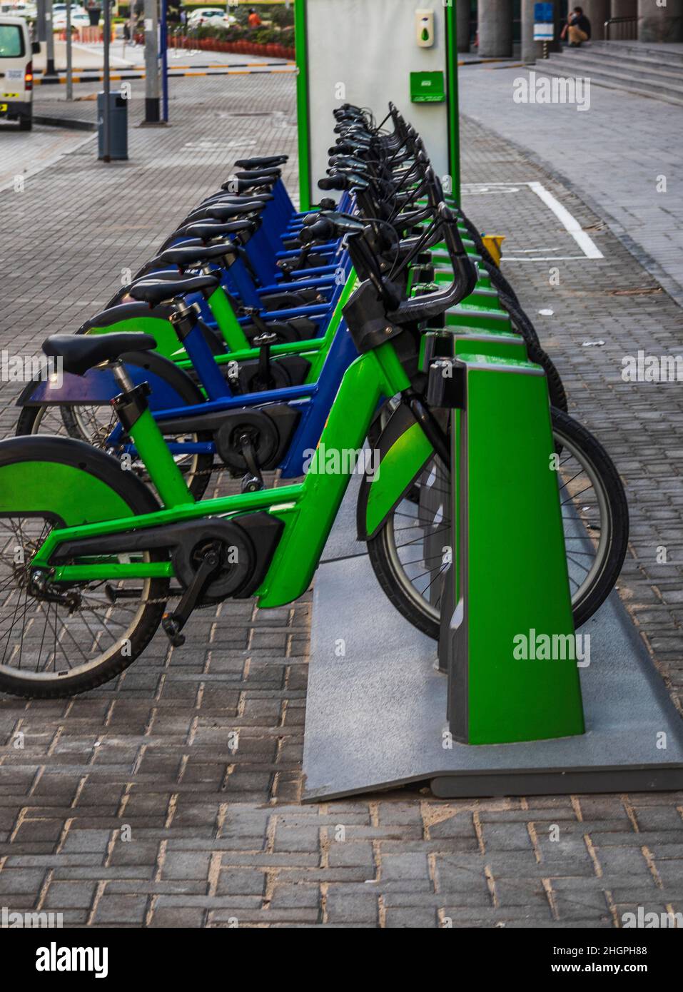 Bicycles rental dock station on the street Stock Photo - Alamy