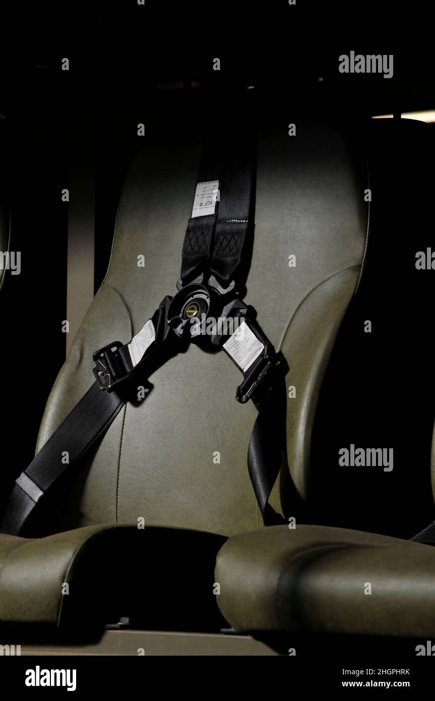A close up portrait view of a new build, military troop transport, seat ...