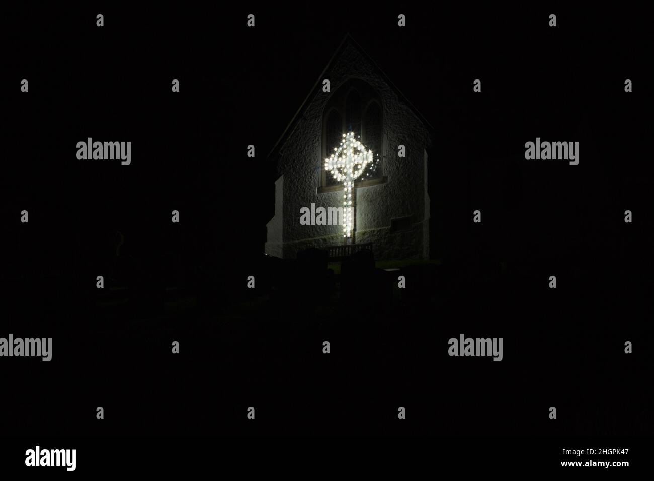 Celtic cross in lights at St Peter's church, Coverack, Cornwall. Part ...