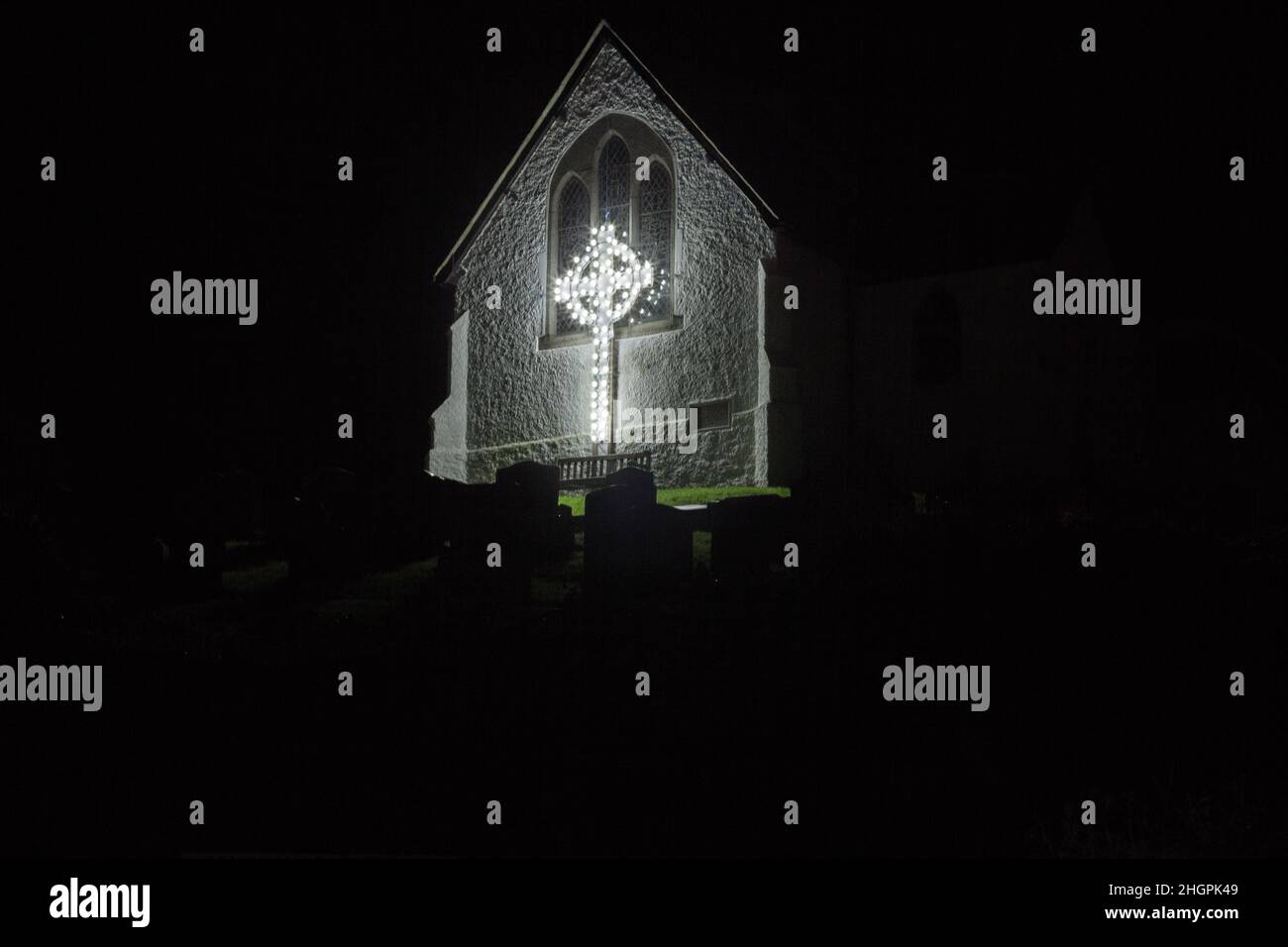 Celtic cross in lights at St Peter's church, Coverack, Cornwall. Part ...