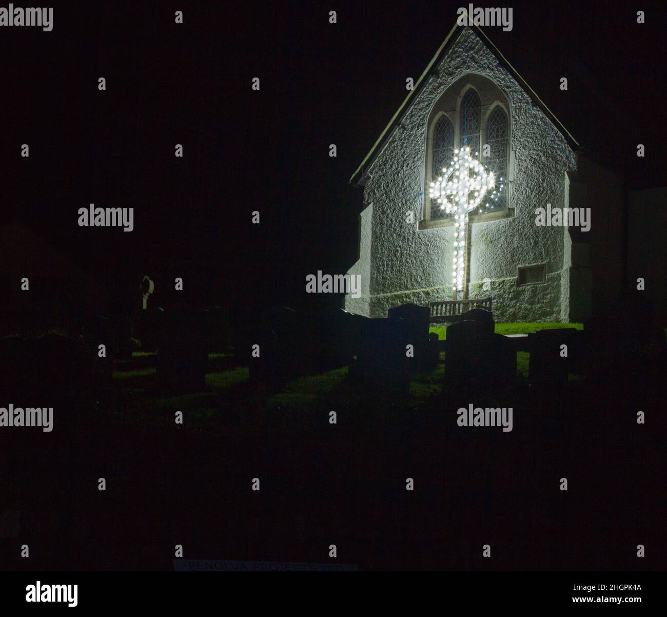 Celtic cross in lights at St Peter's church, Coverack, Cornwall. Part ...