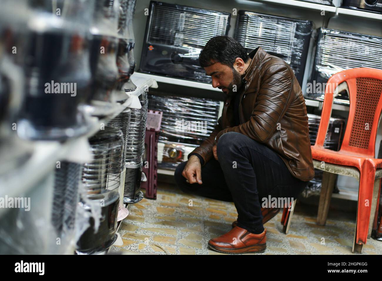Baghdad, Iraq. 22nd Jan, 2022. An Iraqi man checks an oil heater to buy ...