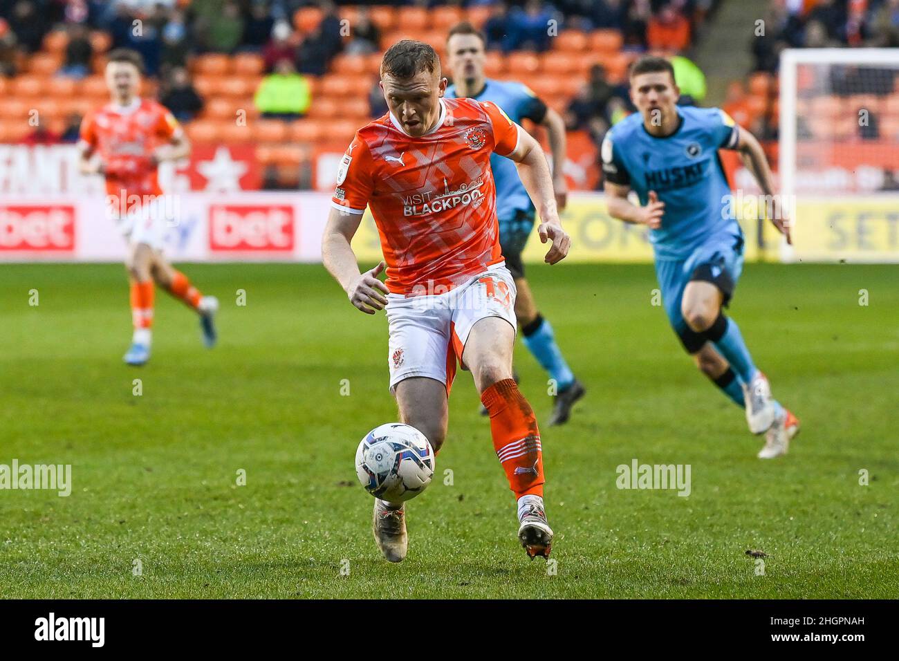 Shayne Lavery #19 of Blackpool makes a break with the ball Stock Photo ...