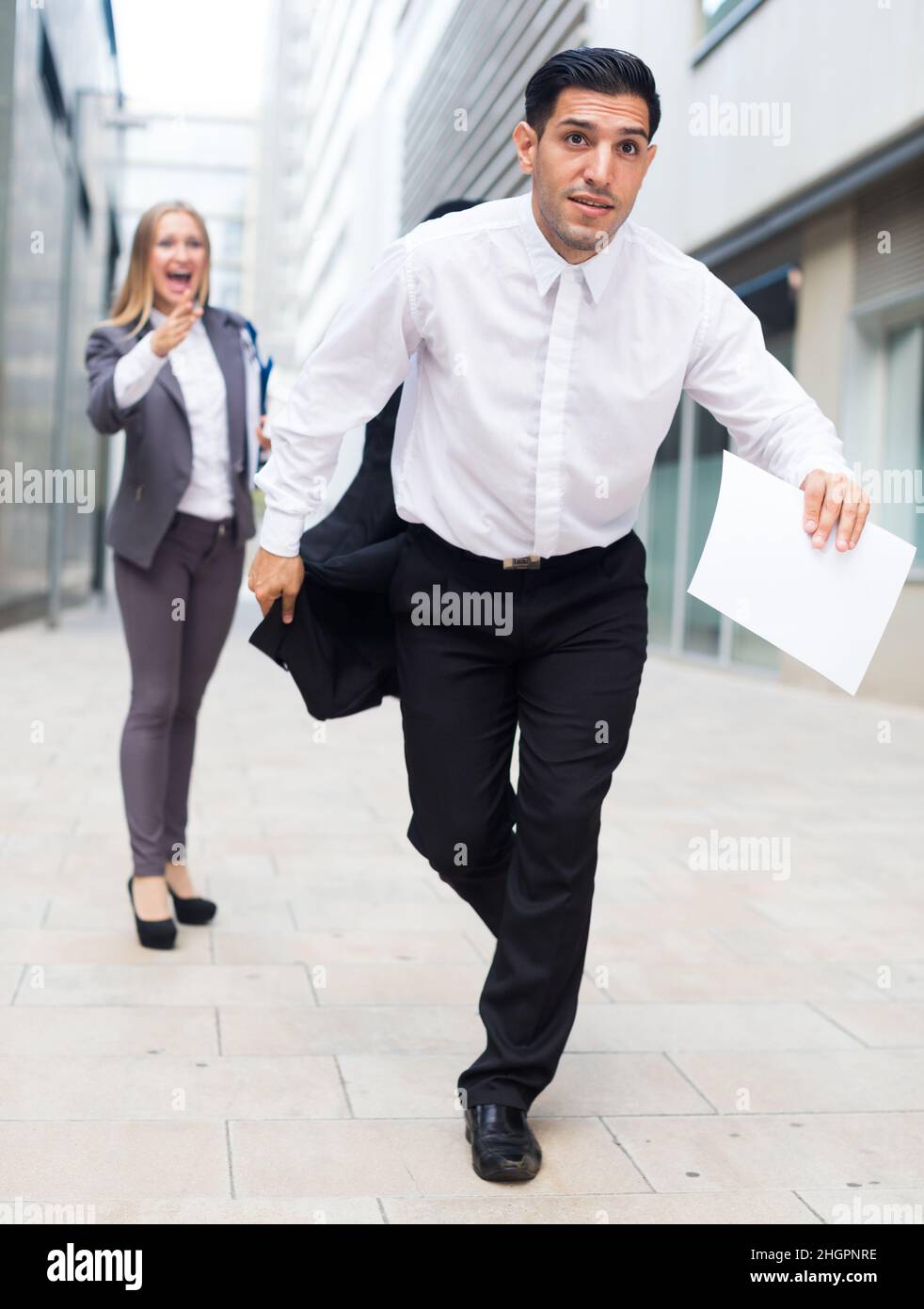 Adult employee is running away with documants from his female boss ...
