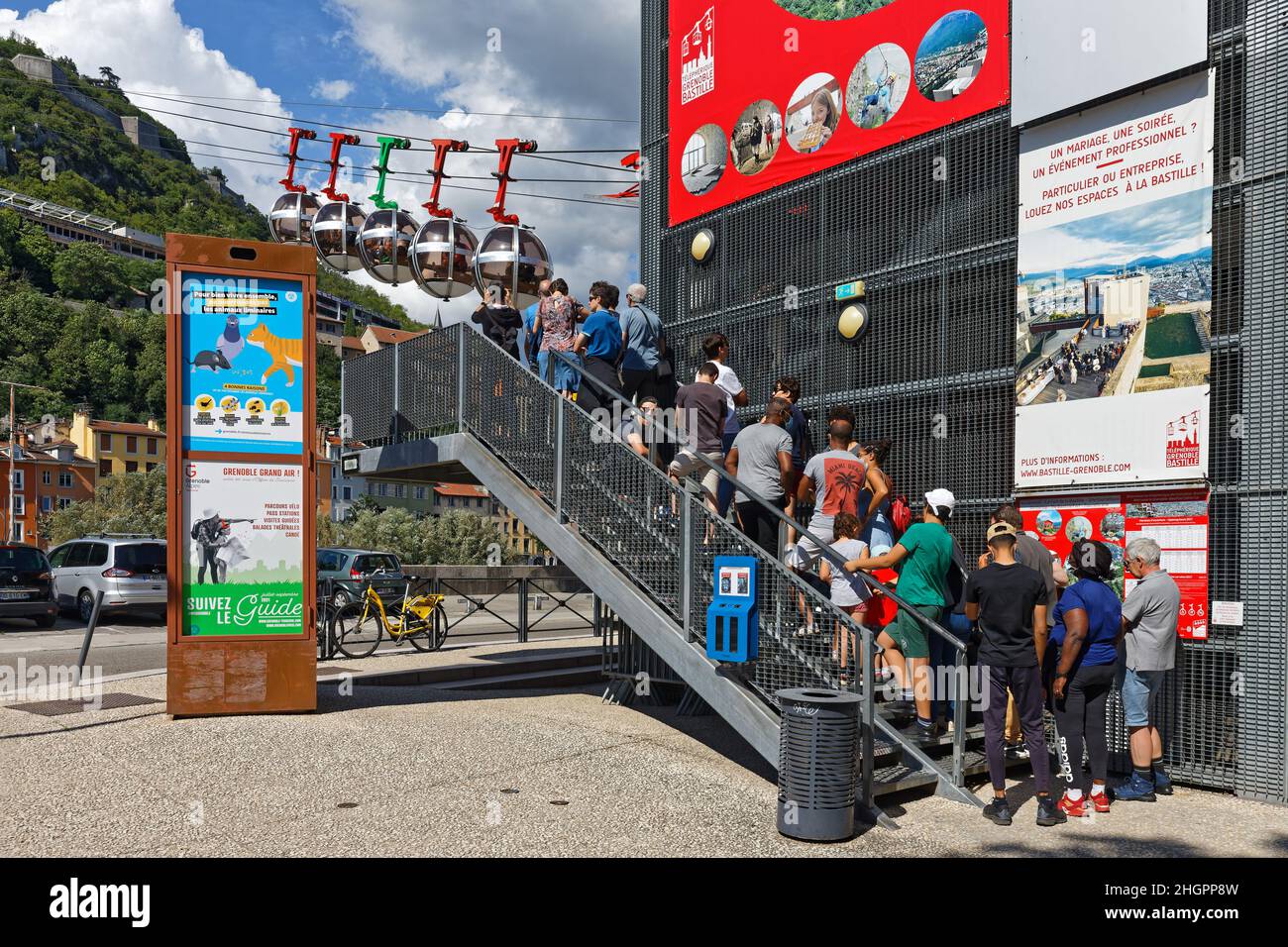 GRENOBLE, FRANCE, August 2, 2021 : Tourists wait for the start of cable ...