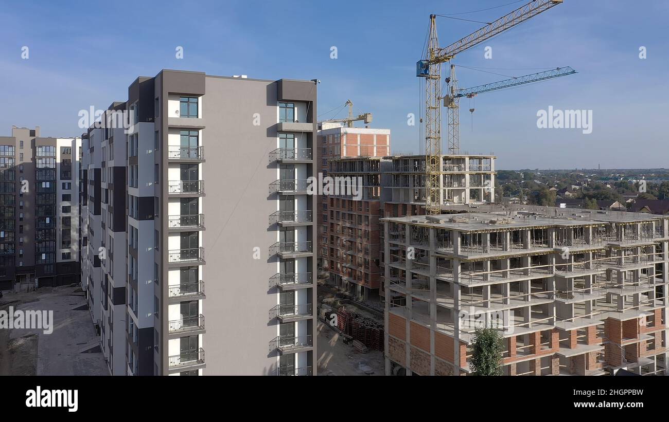 Aerial view of concrete frame of tall apartment building under ...