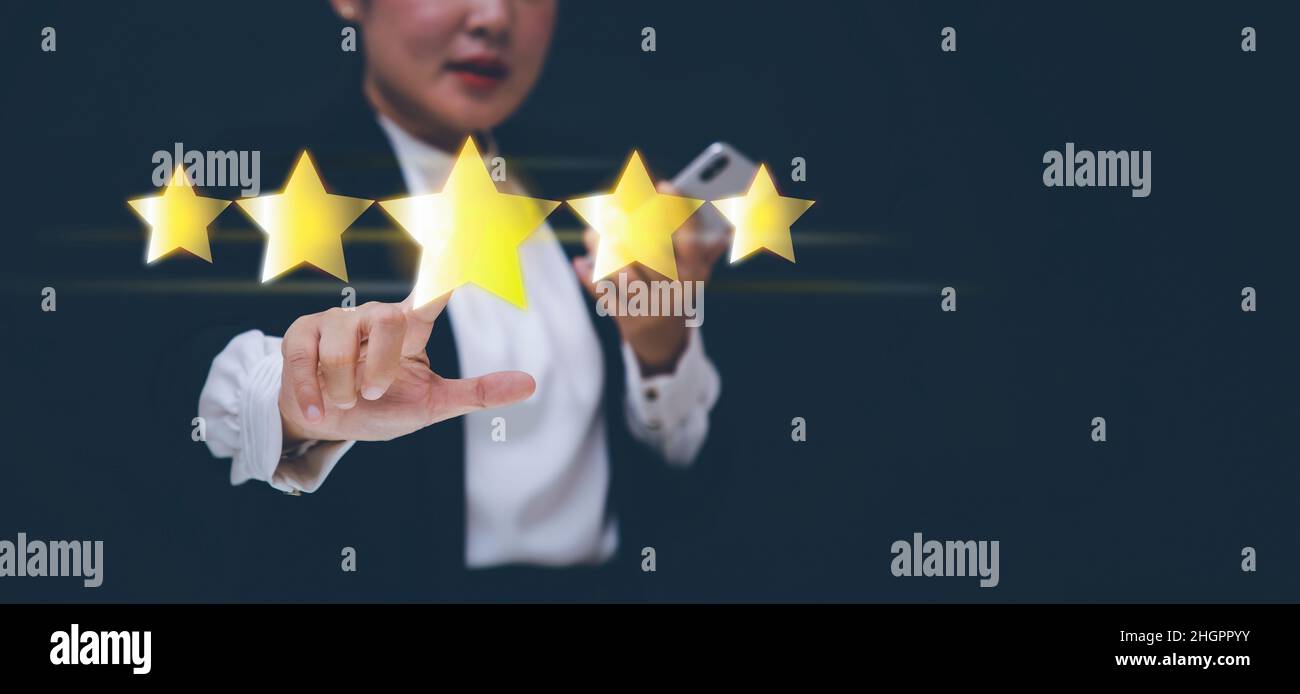 The concept of placing rating. woman touching technology on five star ...