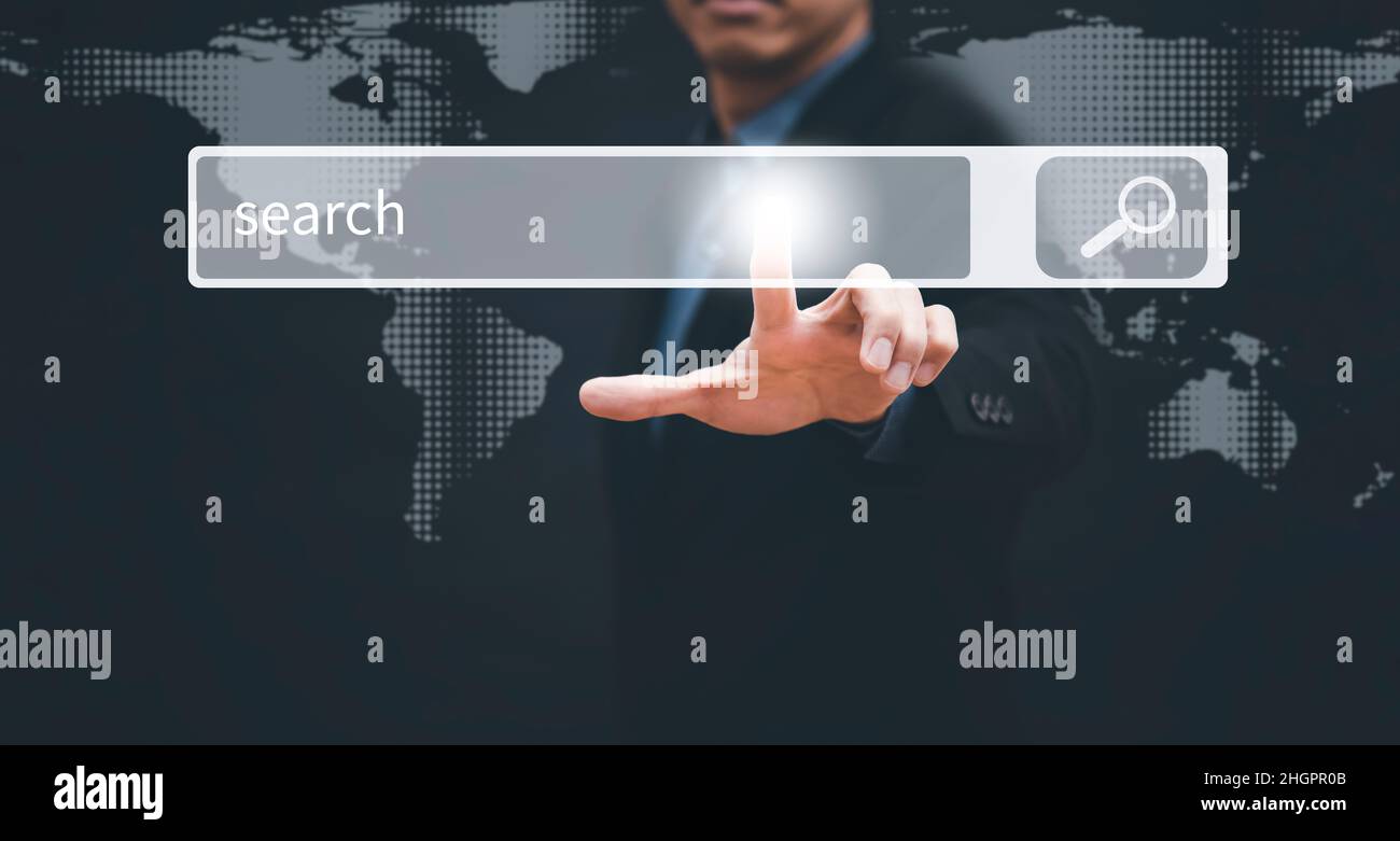 Businessman clicking internet search page on a computer touch screen or ...