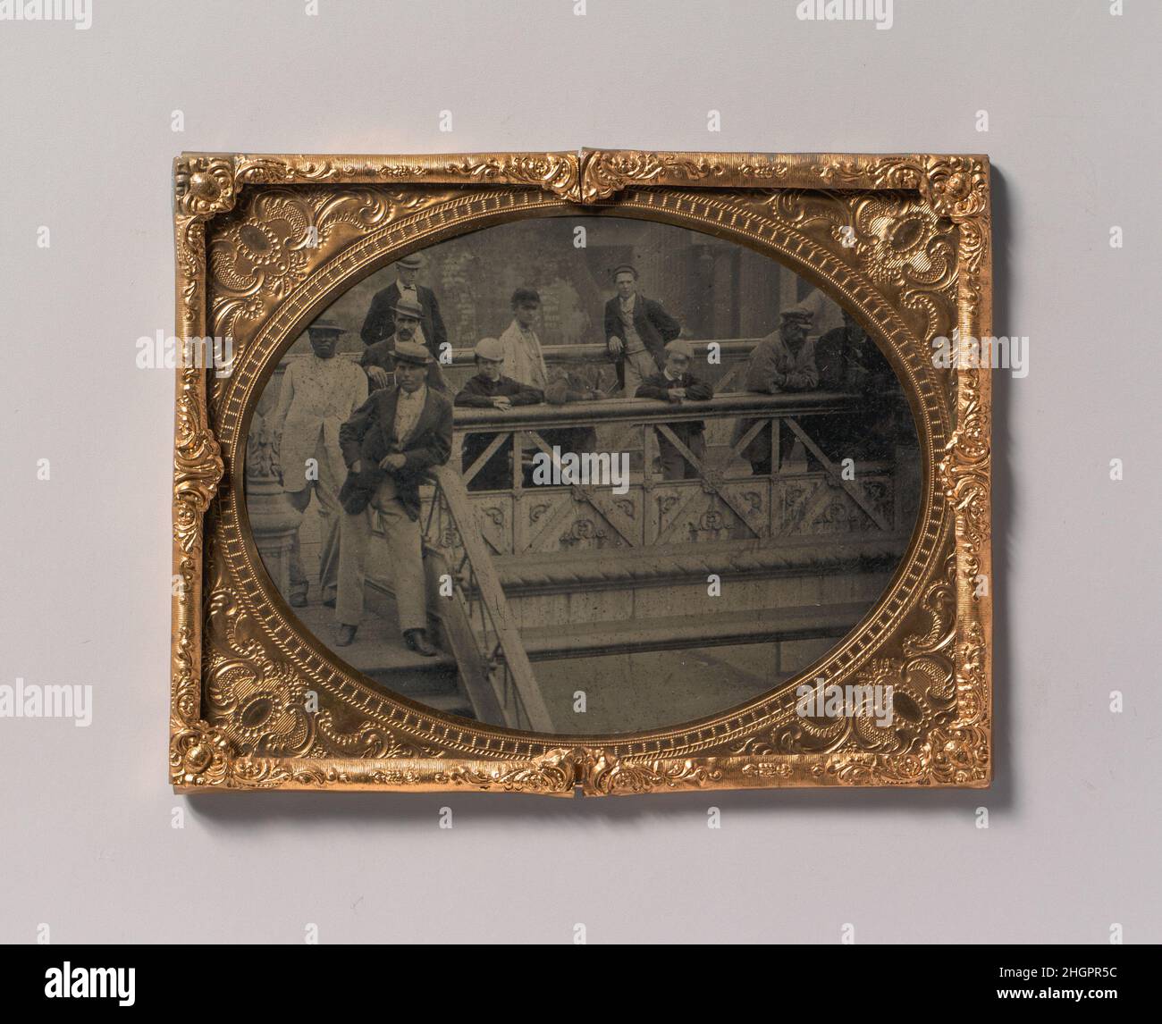 [Group of Men and Boys Standing Along the Railing of the Fulton Street ...