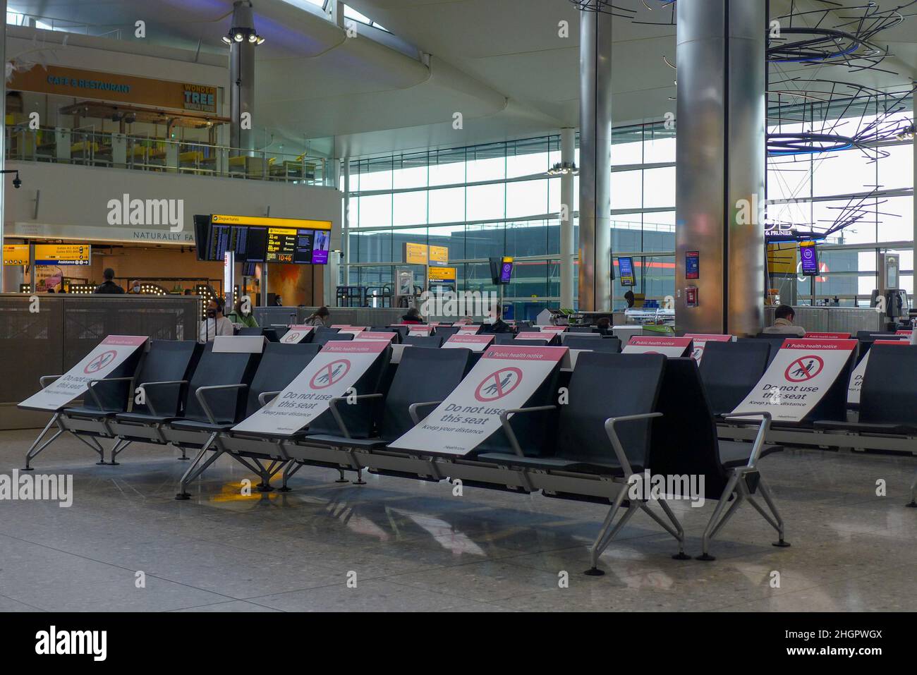Heathrow International Airport, London, UK - May 8 2021: few passengers ...