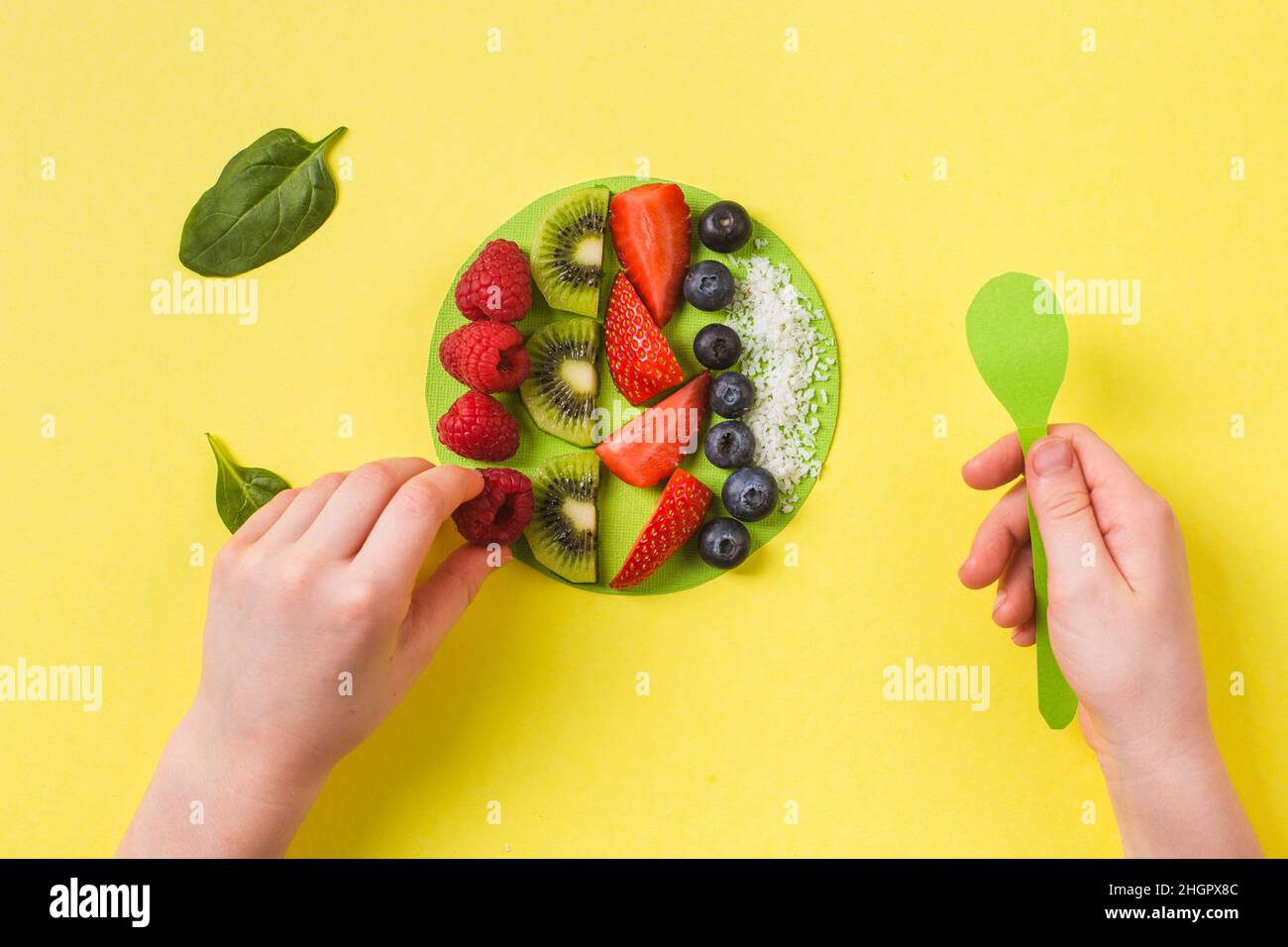 smoothie bowl with fresh berries and fruits in paper craft plate on ...