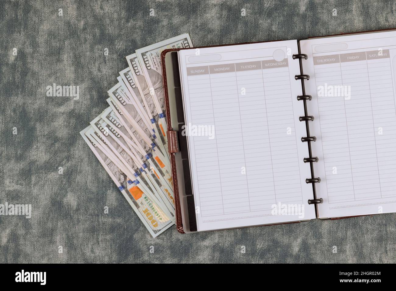Workplace with notepad with one hundred dollar bills on flat view Stock ...