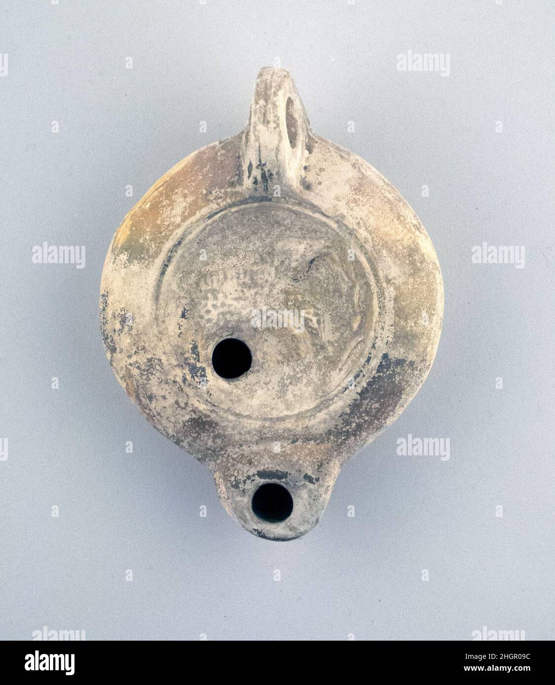 Terracotta oil lamp ca. A.D. 90‒140 Roman, Italian On discus: three ...